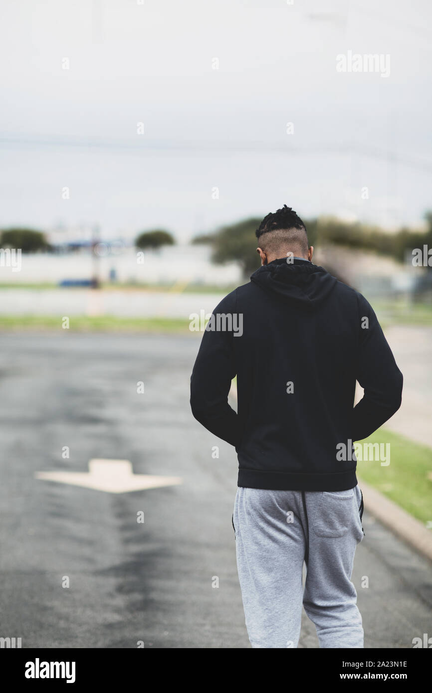 Man wearing hoddie hi-res stock photography and images - Alamy