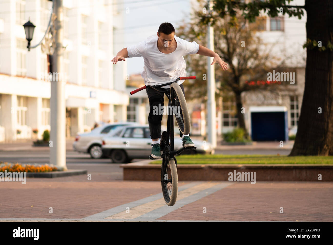 The guy on the BMX bike, releases his hands in a jump Stock Photo - Alamy