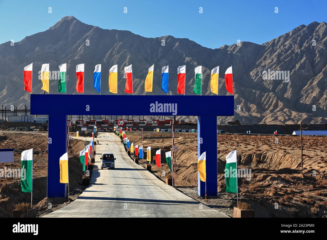 Blue arch with flags-entrance to mining facility-Nnal.Highway G315 ...