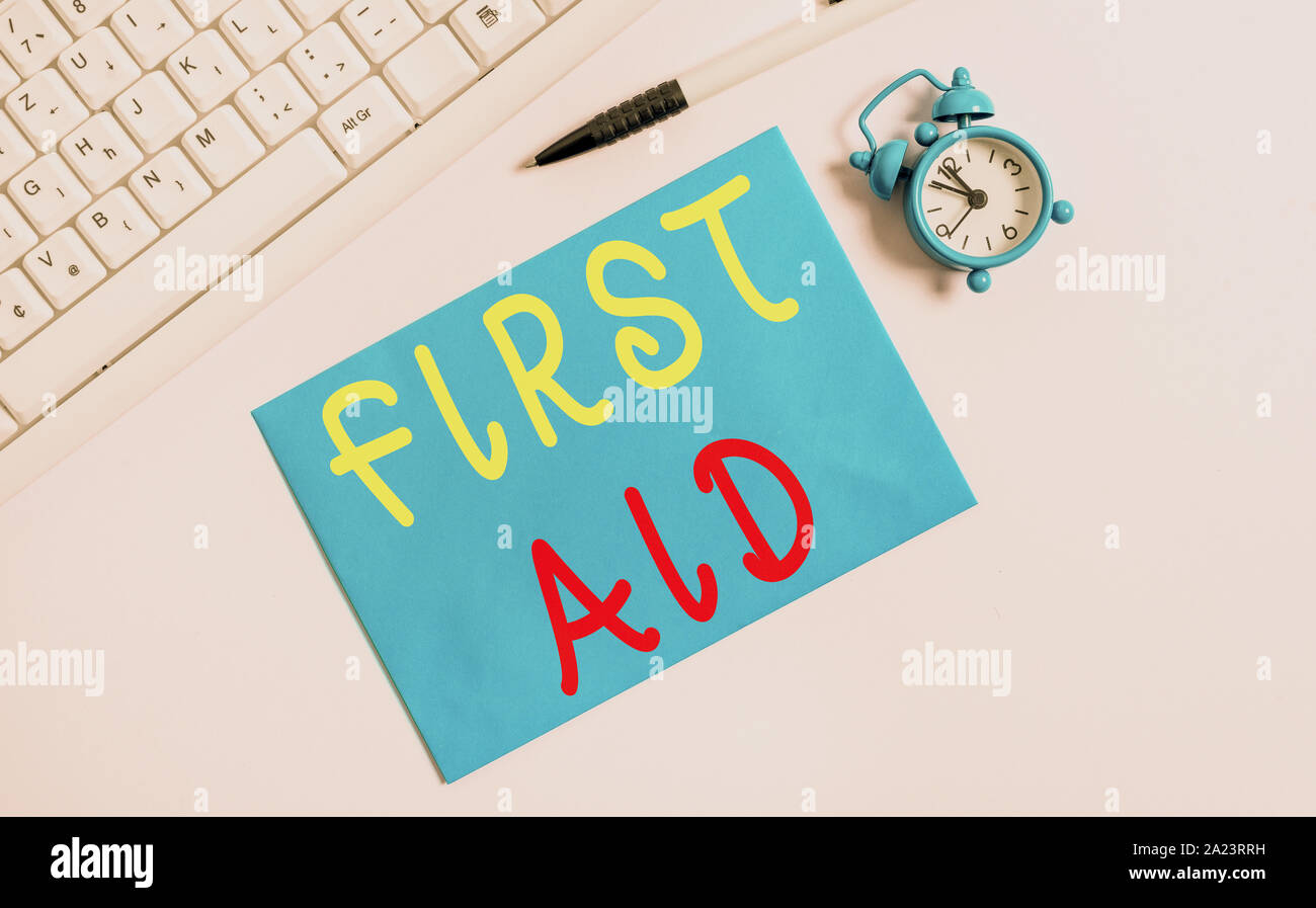 Writing note showing First Aid. Business concept for Practise of ...