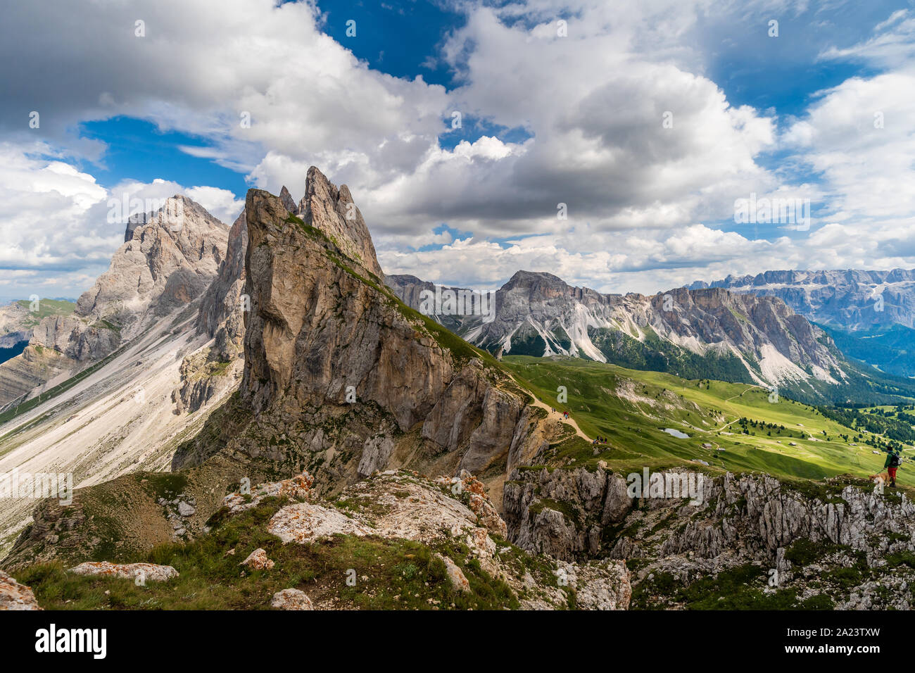 Man with dog is looking the most beautiful peak of Seceda at the ...