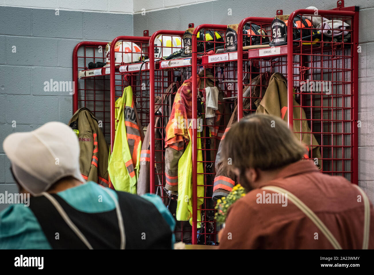 Amish family at country fair, auction Stock Photo - Alamy