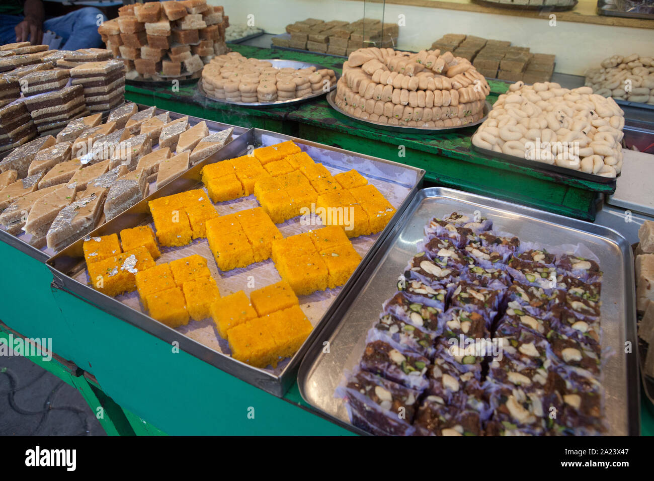 Display of Indian sweets (Barfi) in a shopfront window, Kolkata, India ...