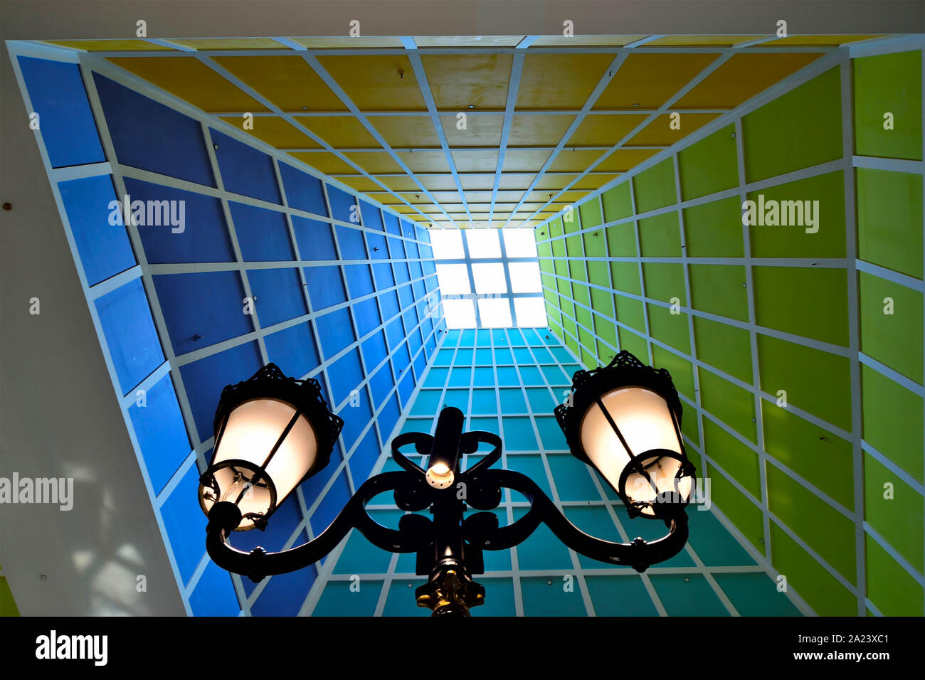 Abstract perspective of vertical lobby ceiling with skylight and strong ...