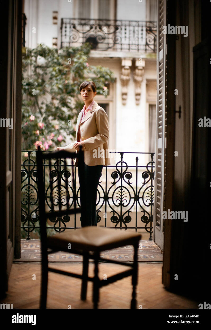 Side view of a young professional from the balcony of her home Stock ...