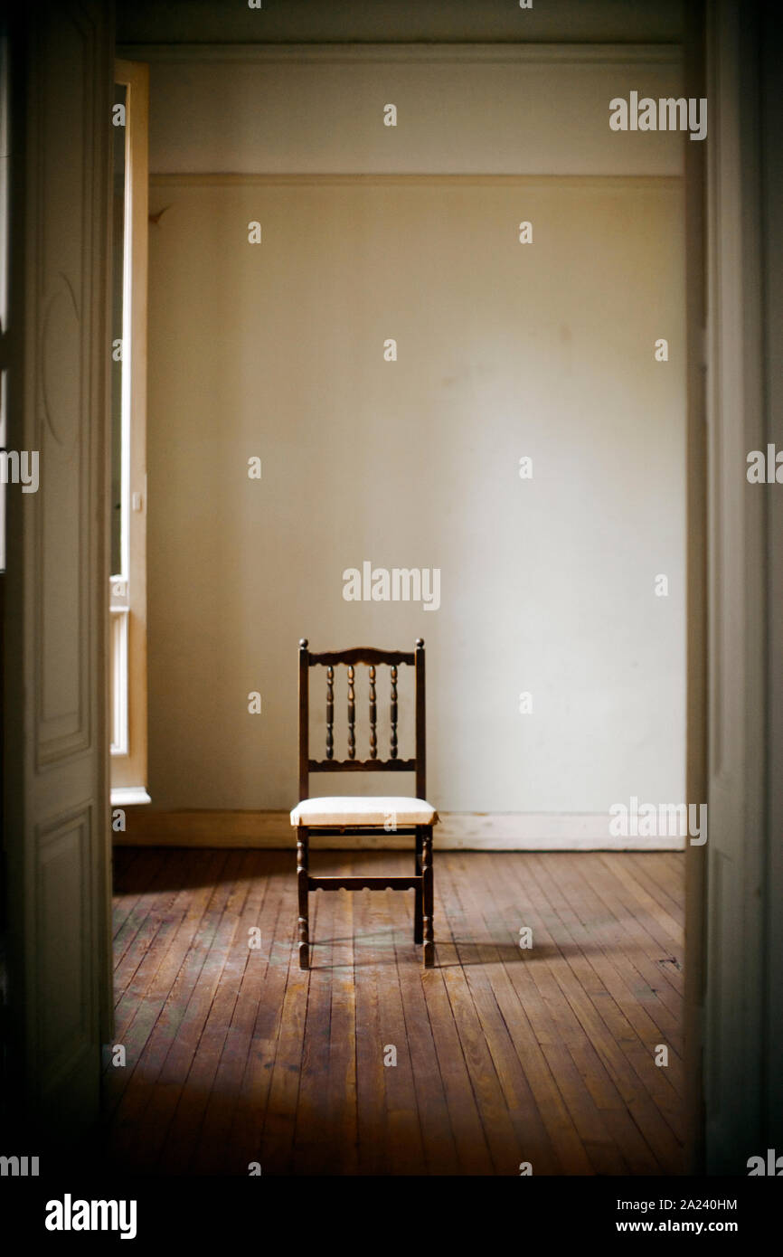 View of a chair seen through an entrance Stock Photo - Alamy