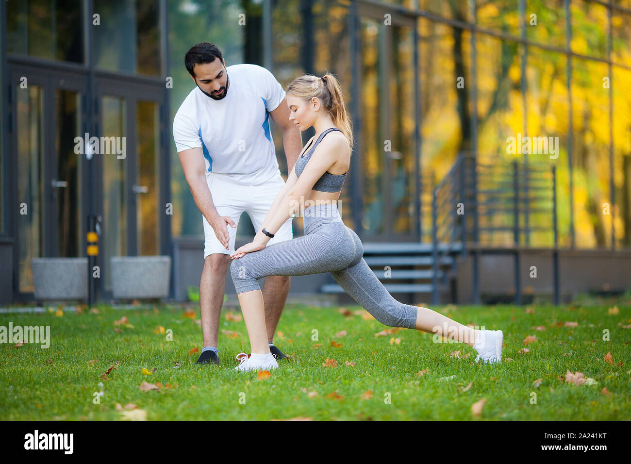 Fitness. Personal Trainer Takes Notes While Woman Exercising Outdoor ...