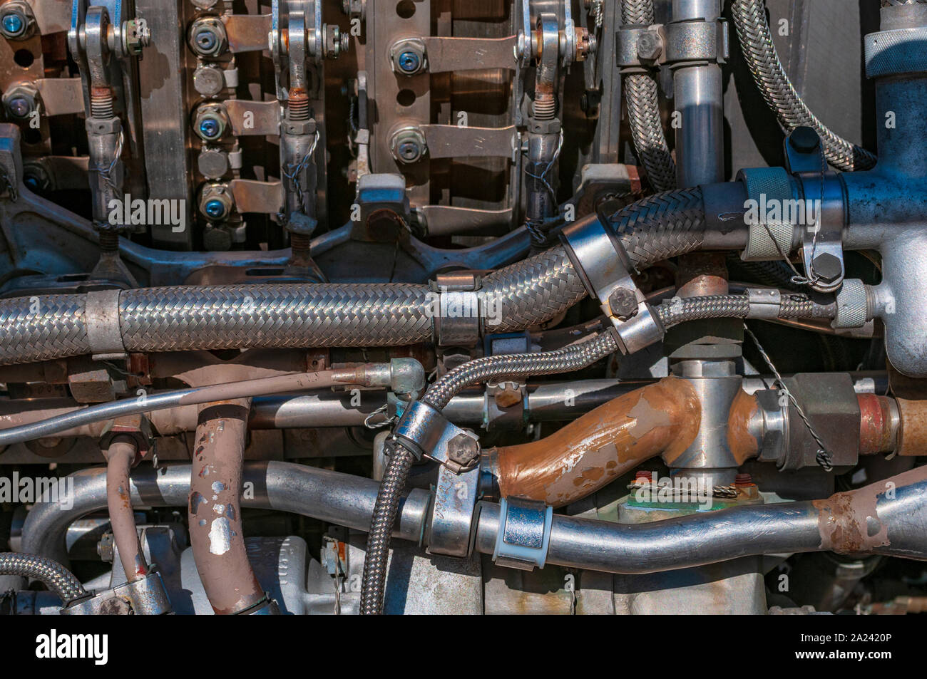 Aircraft jet engine parts. Mechanical background. Tubes, pipes, bolts ...