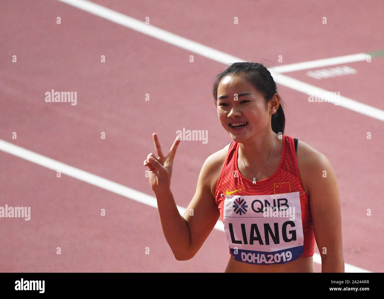 Doha, Qatar. 30th Sep, 2019. Liang Xiaojing of China reacts after the ...