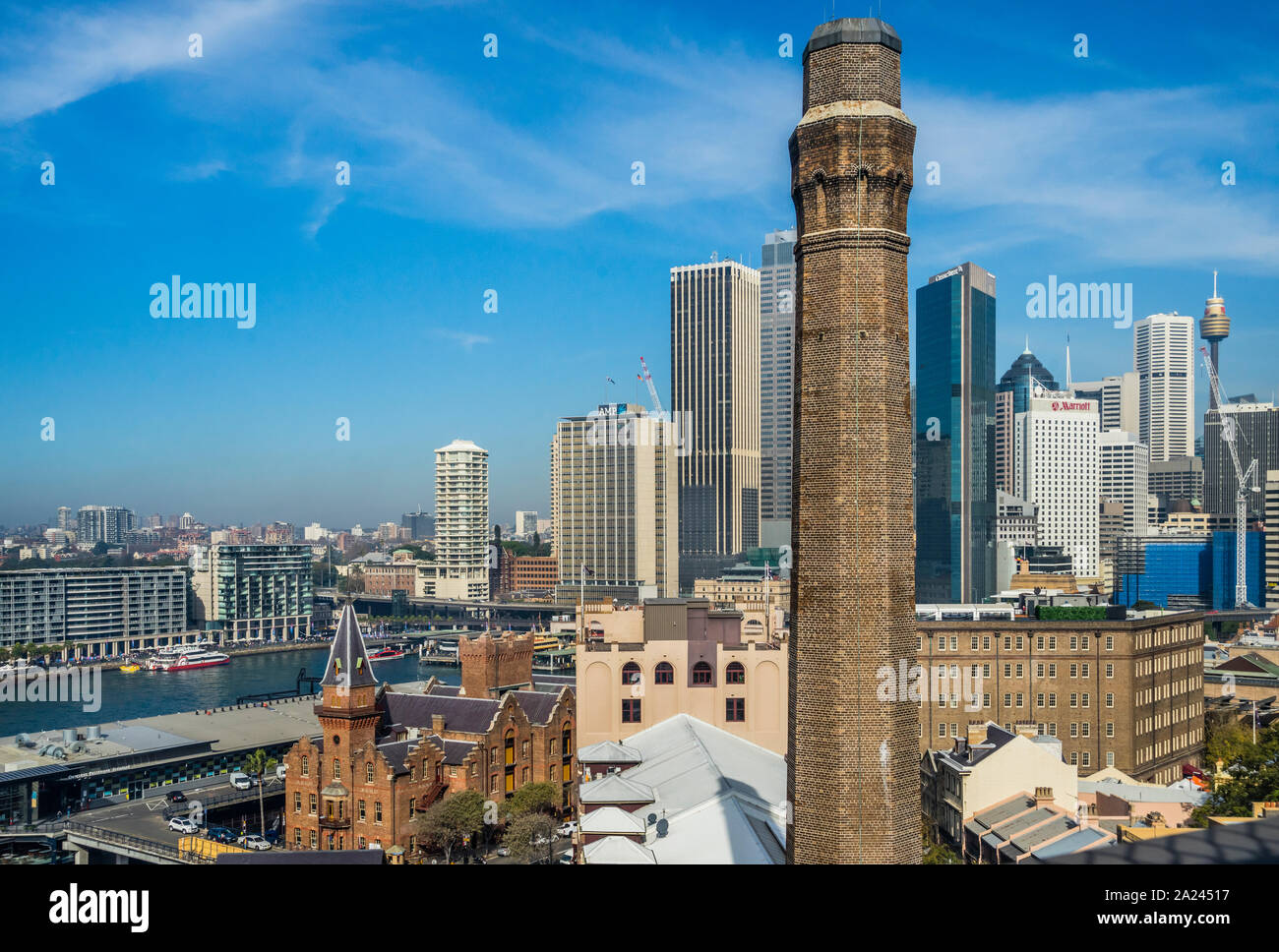 the historic brick chimney of a former electrical power station looms ...