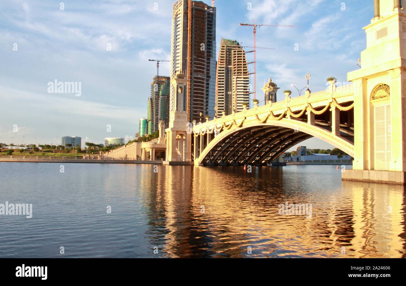Putrajaya bridge one evening with building under construction in ...