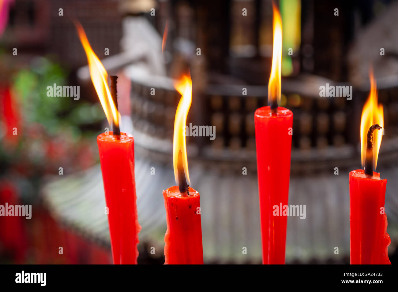 Red candles burning in a taoist temple in QingChengShan, Sichuan ...