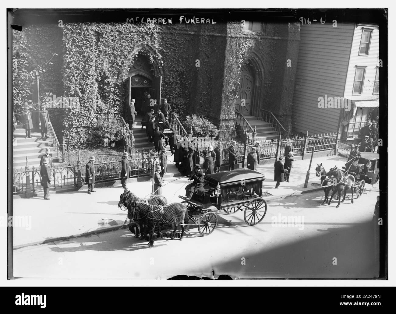 Pallbearers bearing coffin into church from caisson at McCarren funeral ...