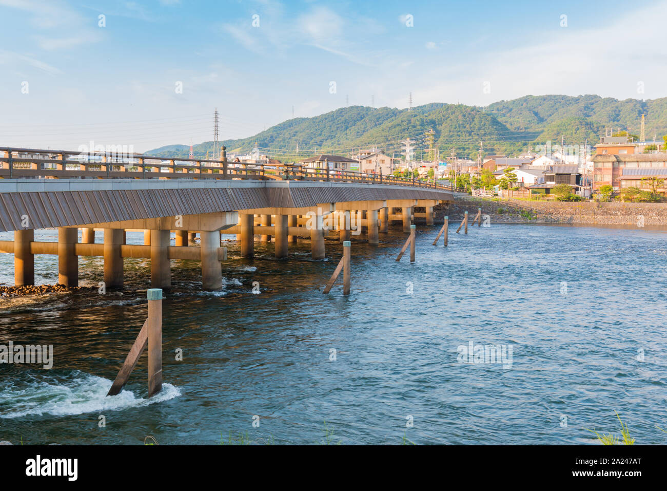 View of Uji city with the Uji Bridge, Uji River, houses, mountain and ...