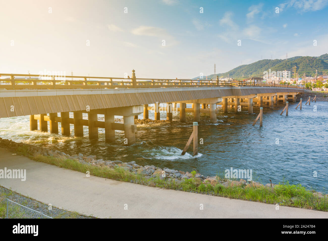 View of Uji city with the Uji Bridge, Uji River, houses, mountain and ...