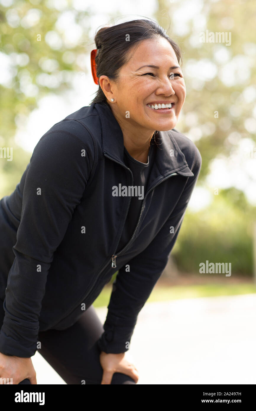 Portrait of a fit Asian woman exercising Stock Photo - Alamy