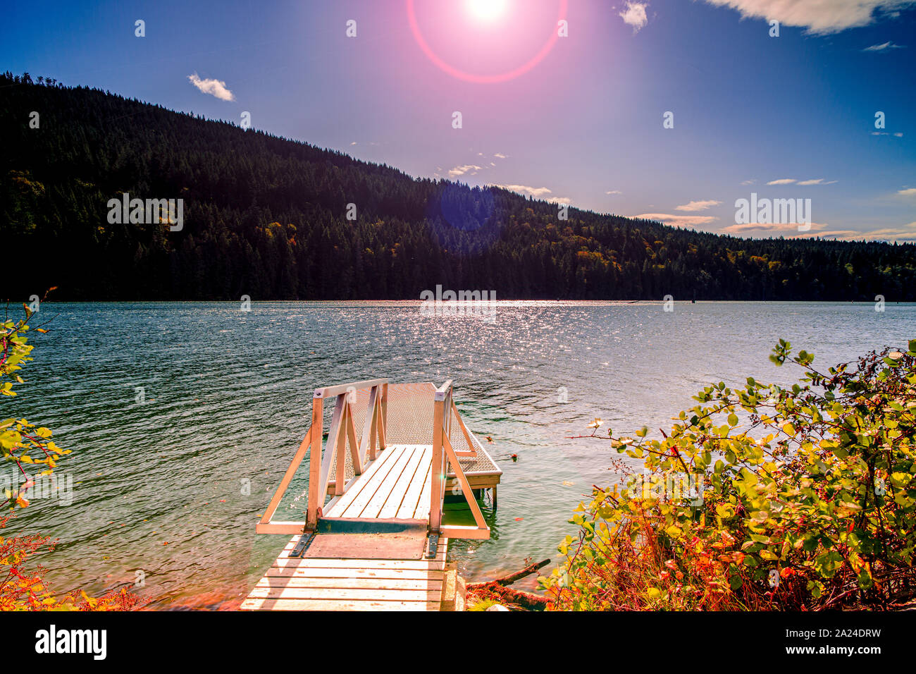 Dock on lake on a bright Autumn morning Stock Photo - Alamy