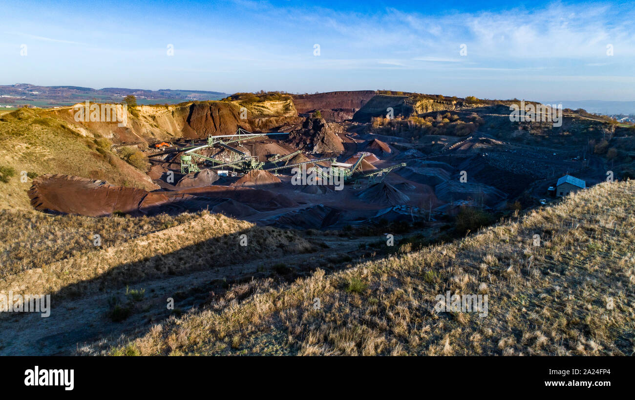 Aerial view of machinery in open gravel pit mining. Processing plant ...