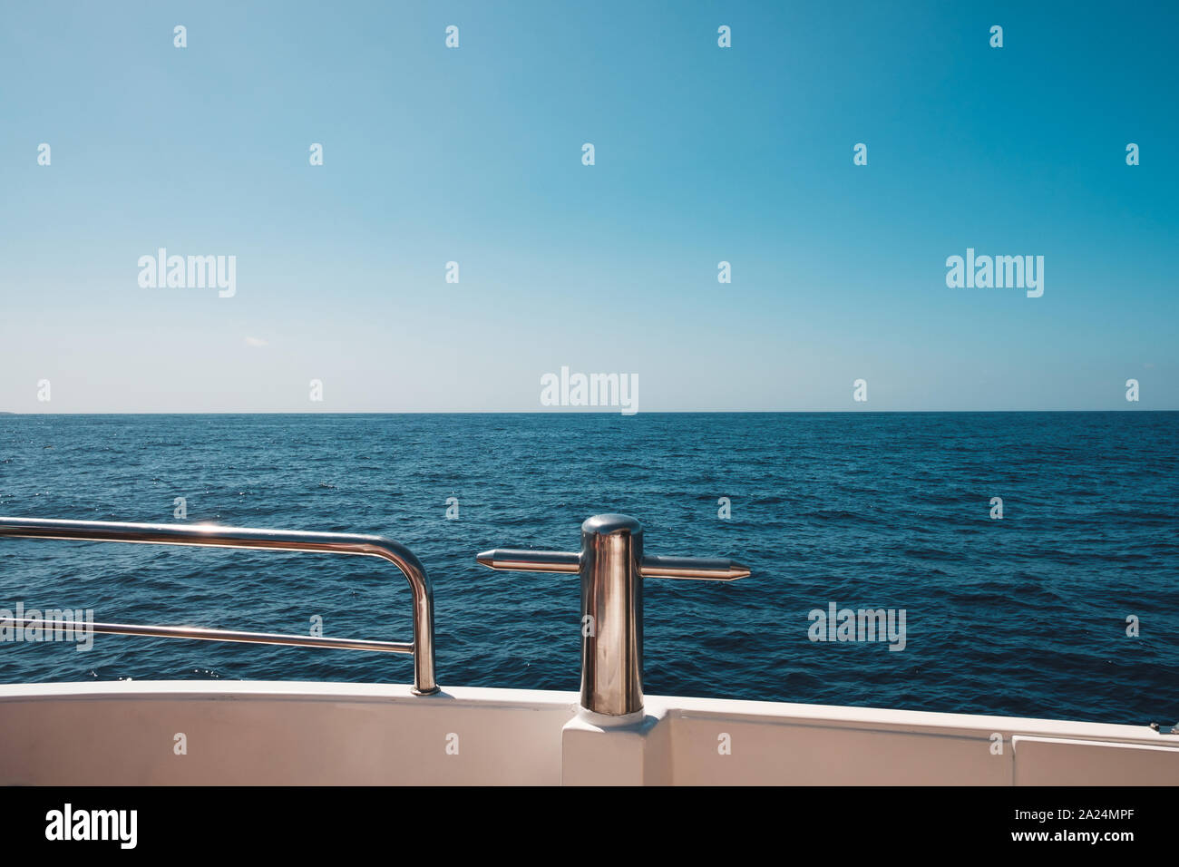 ocean and blue sky / sea view horizon behind boat railing Stock Photo ...