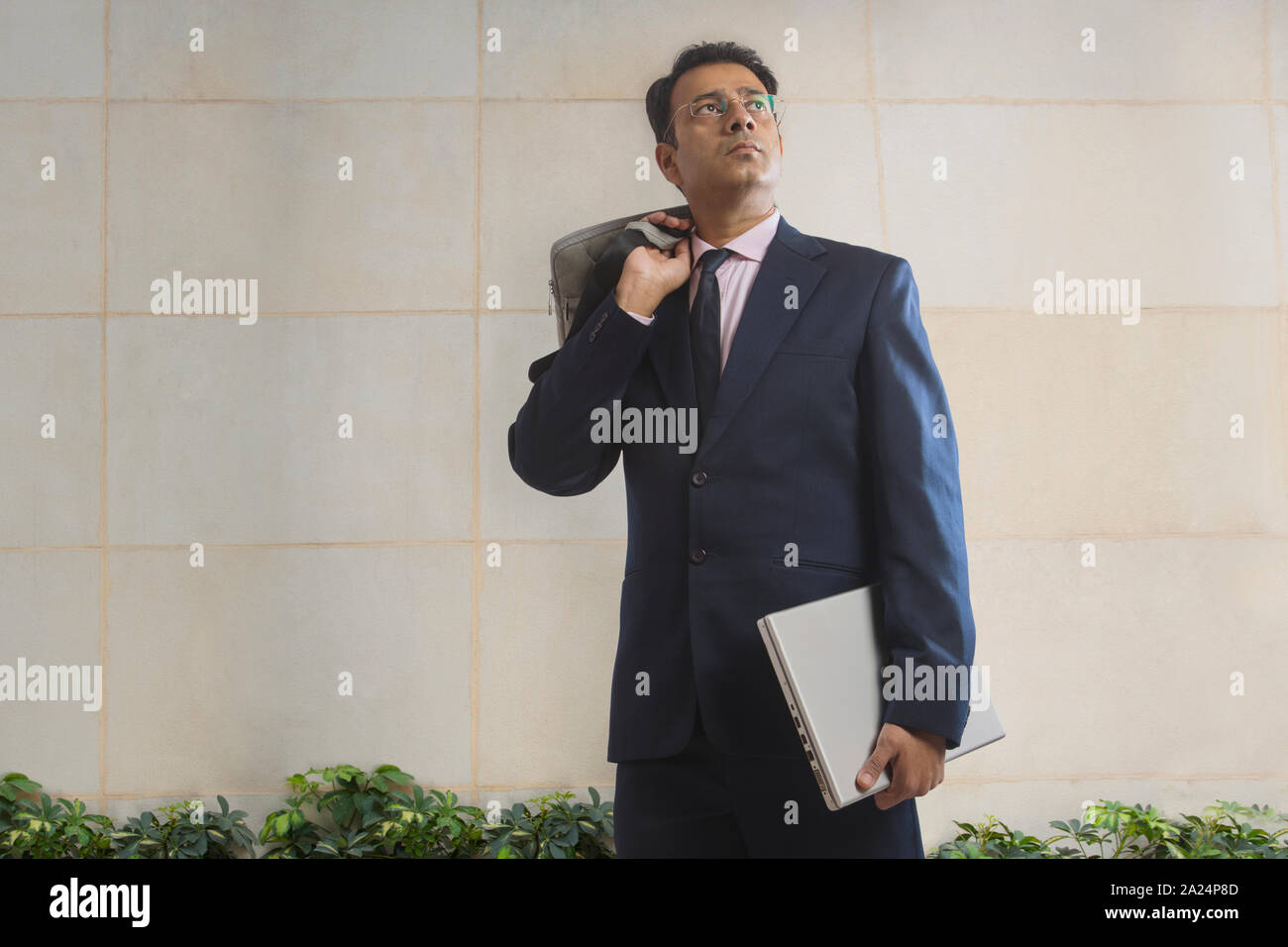 Man Carrying Laptop Bag High Resolution Stock Photography and Images ...