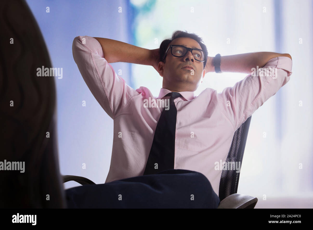 Leaning head on hands hi-res stock photography and images - Alamy