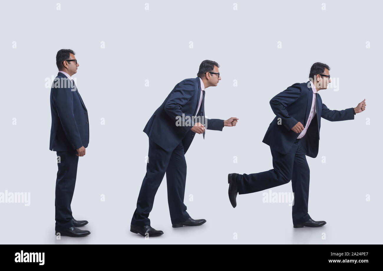 Indian man running in suit hi-res stock photography and images - Alamy