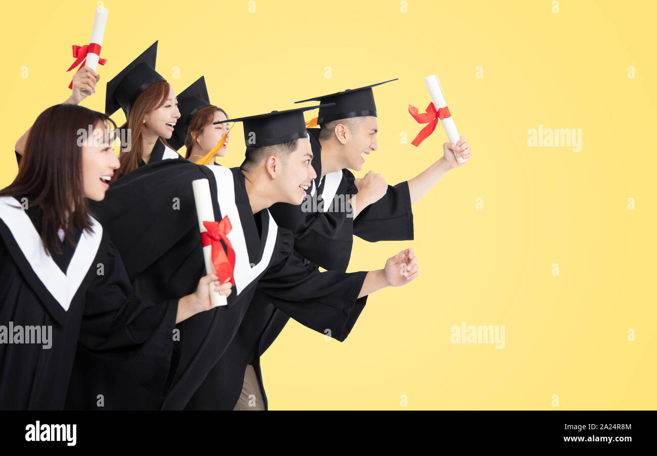 Group of Students Running and Celebrating Graduation Stock Photo - Alamy