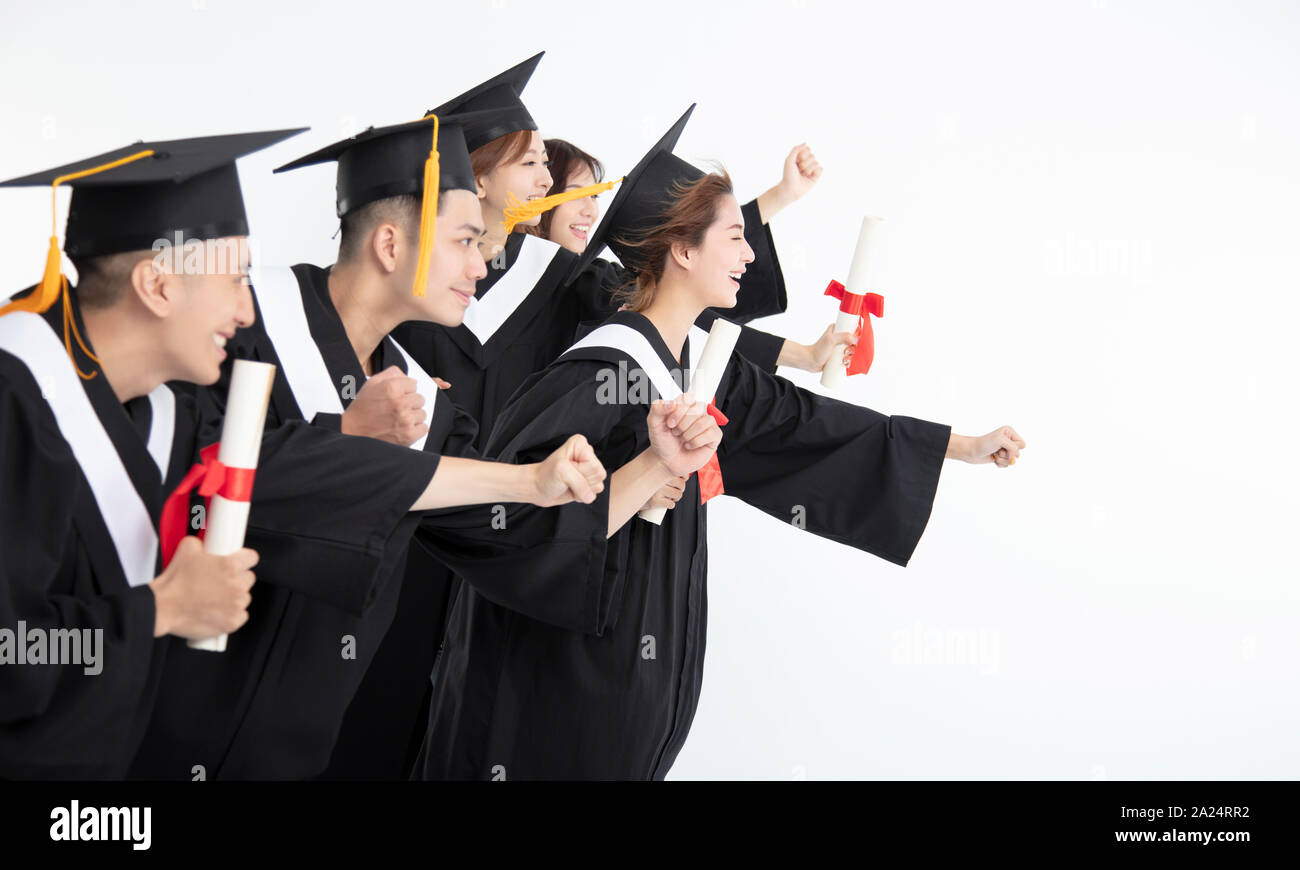 Group of Students Running and Celebrating Graduation Stock Photo - Alamy