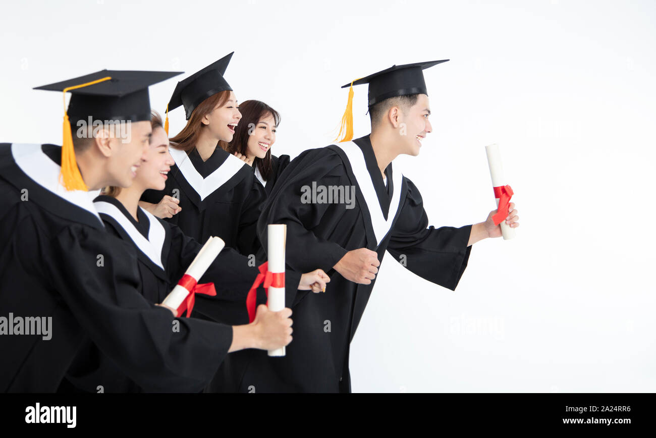 Group of Students Running and Celebrating Graduation Stock Photo - Alamy