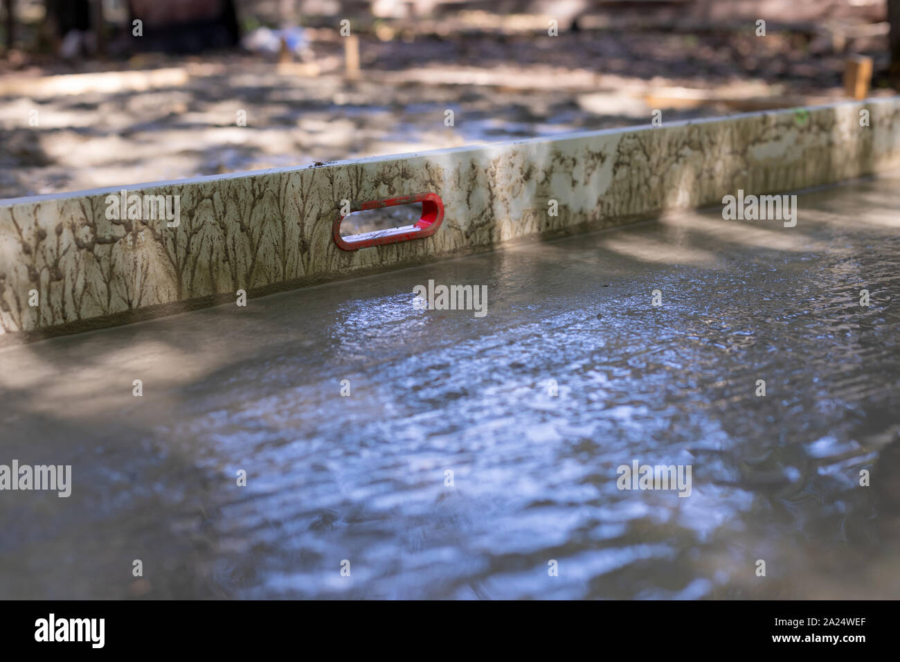 Picture of a straight metal board to level fresh concrete floor Stock ...
