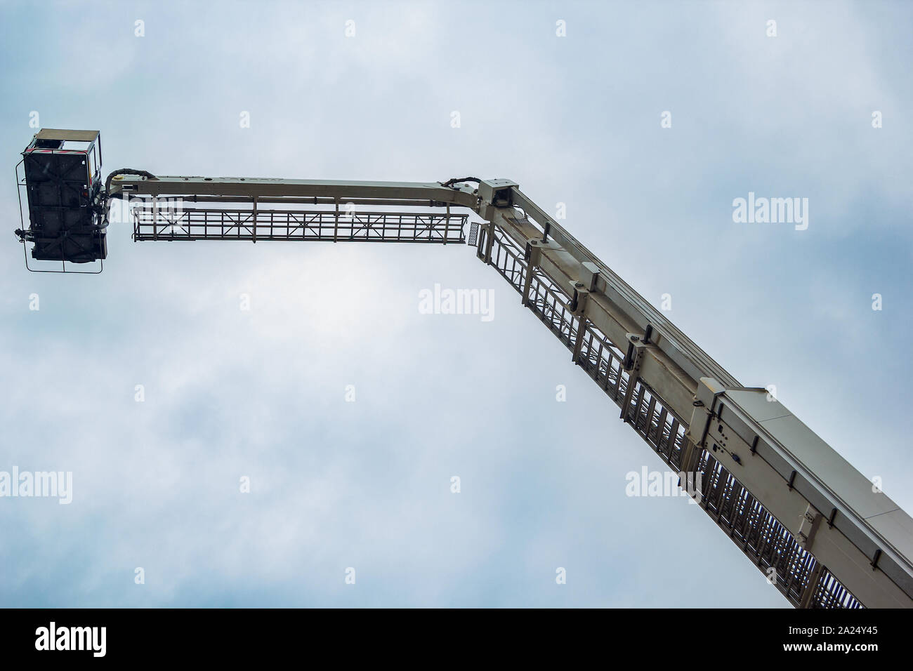 telescopic lift of a fire truck on sky background Stock Photo - Alamy