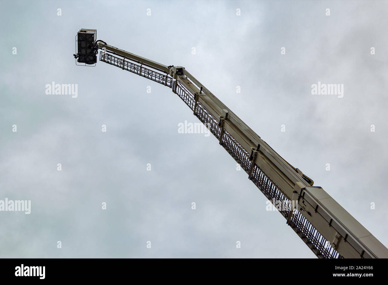 telescopic lift of a fire truck on sky background Stock Photo - Alamy