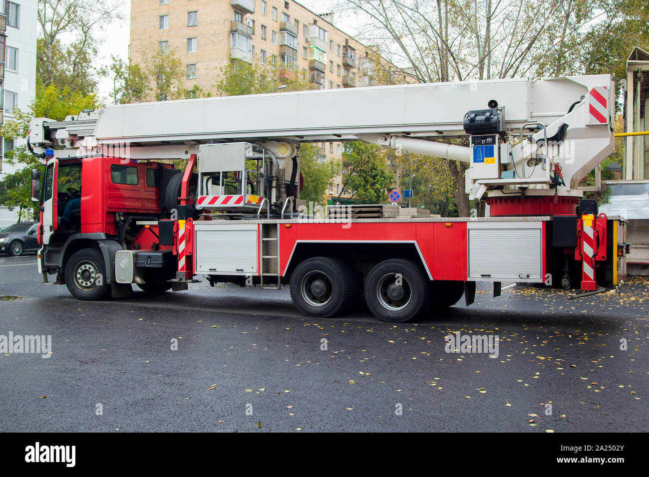 fire truck on a city street in autumn Stock Photo - Alamy