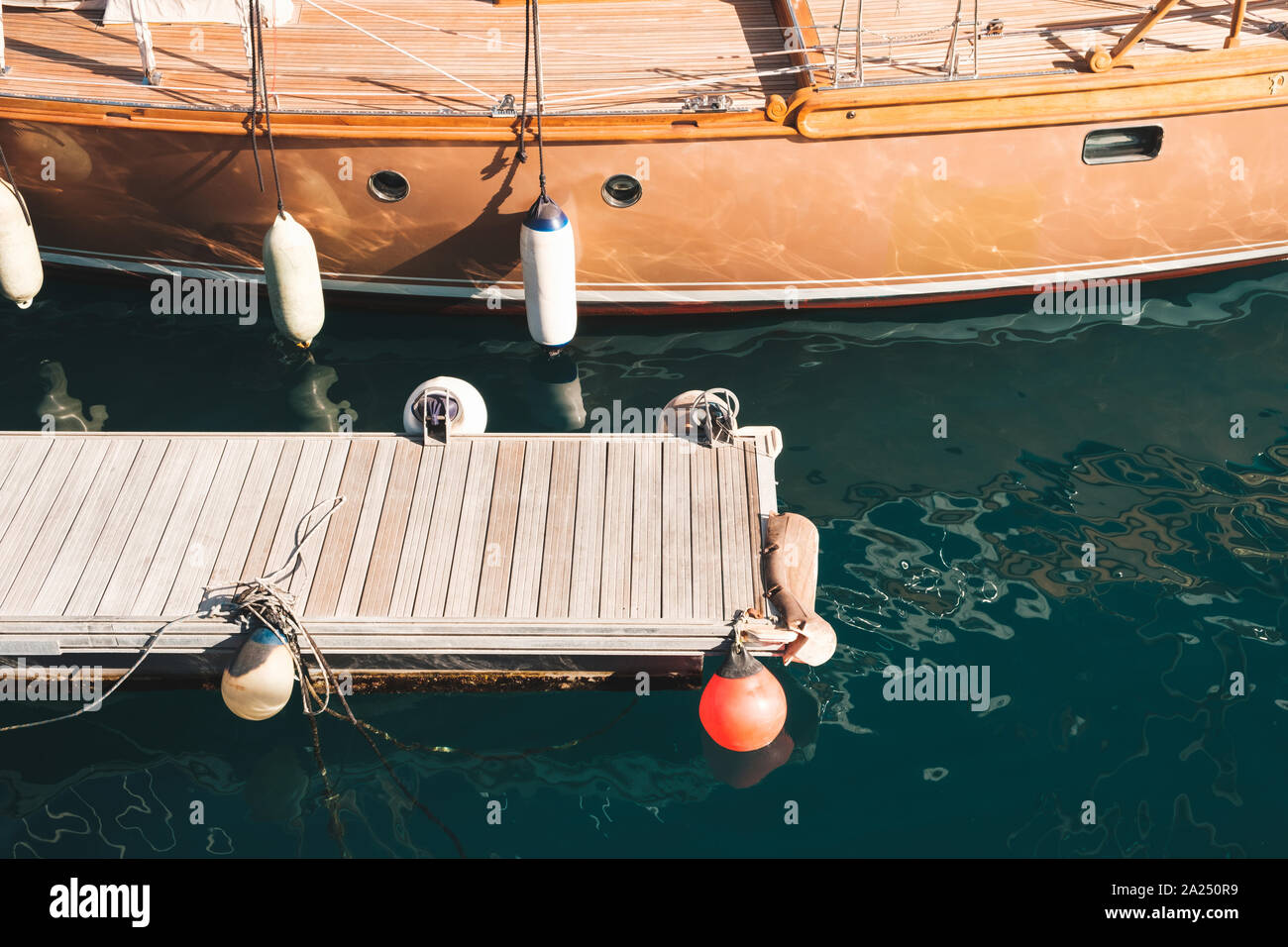 boat pier and sailing boat, parking dock Stock Photo - Alamy