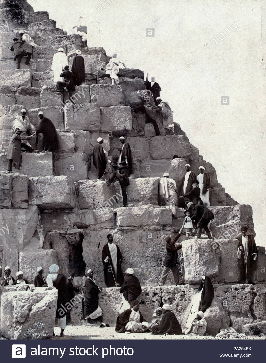 View of Arab men standing on the Great Pyramid at Giza, Cairo, Egypt ...