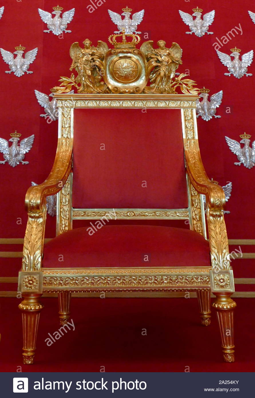 The Throne at the Royal palace Warsaw, Poland. Red and gold dominates ...
