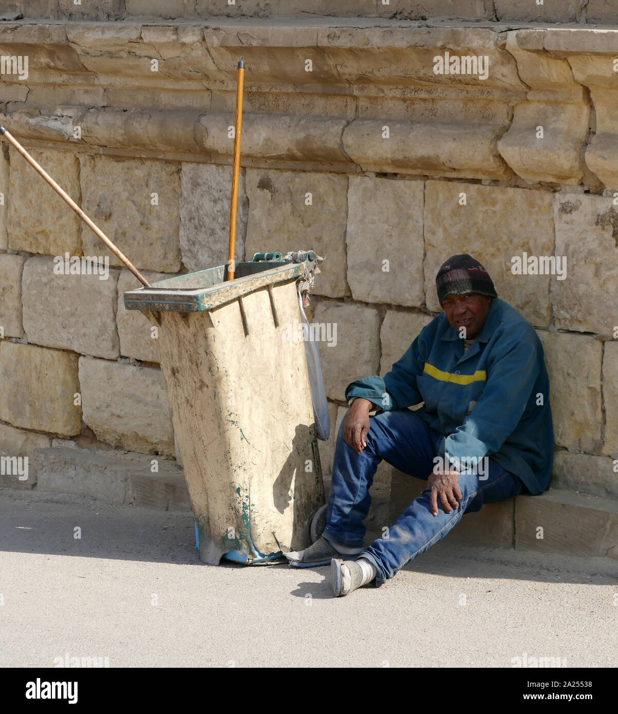 Cleaner taking rest in shade in cairo hi-res stock photography and ...