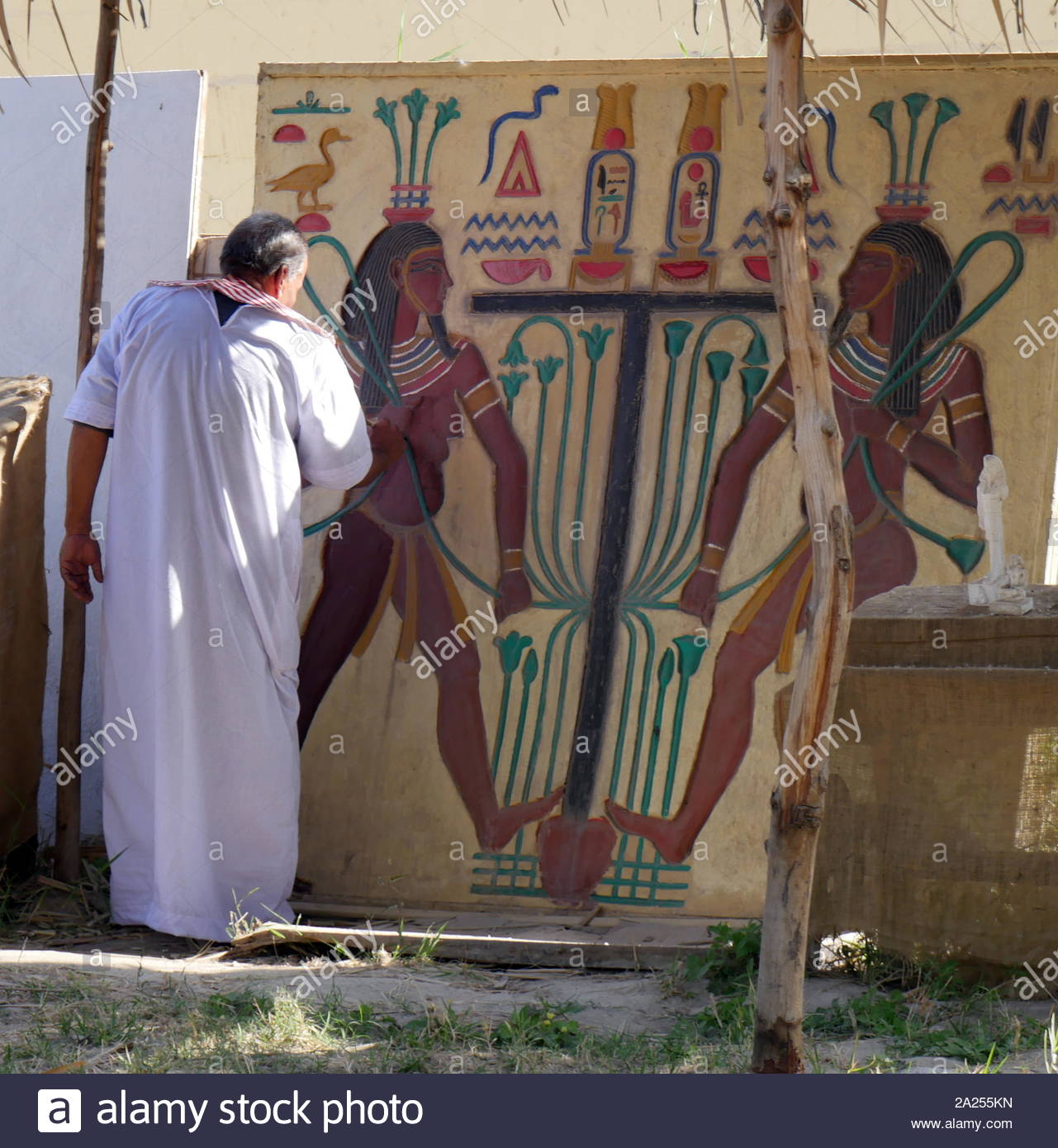 Replica of an ancient Egyptian tomb artist at work on a painted relief ...