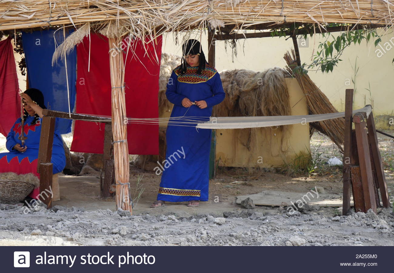 Re-enactment of ancient Egyptian women preparing wool for cloth Stock ...