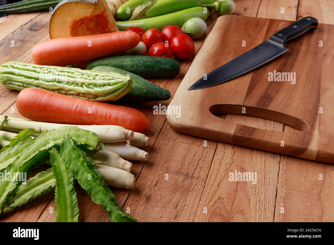 Thai kitchen. Various vegetables, spices and Ingredients with knife and ...