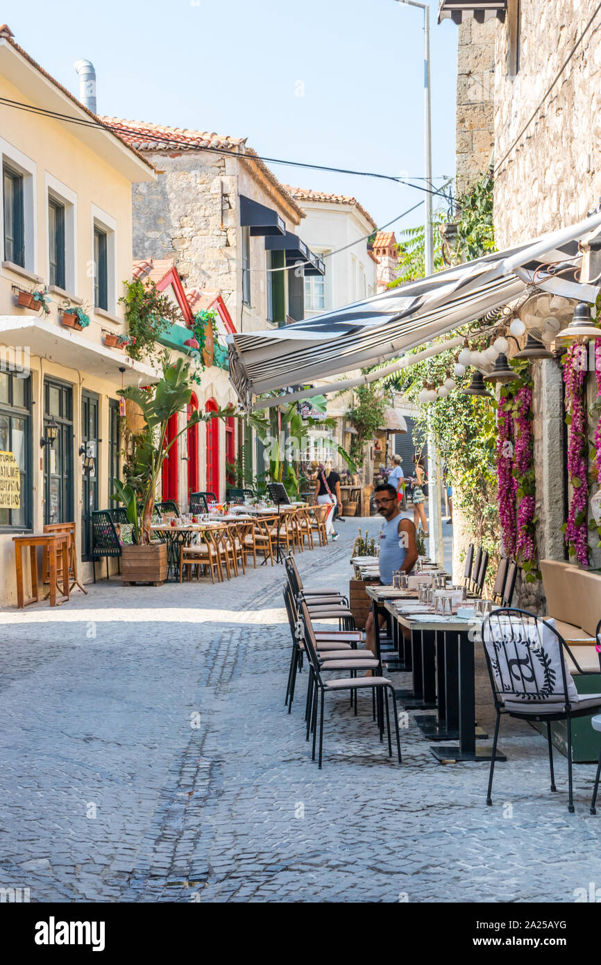 Alacati, Turkey - September 4th 2019: Man sat in a cafe restaurant in a ...