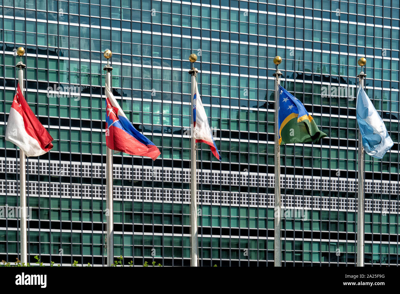 flags waving outside united nations building in manhattan new york ...