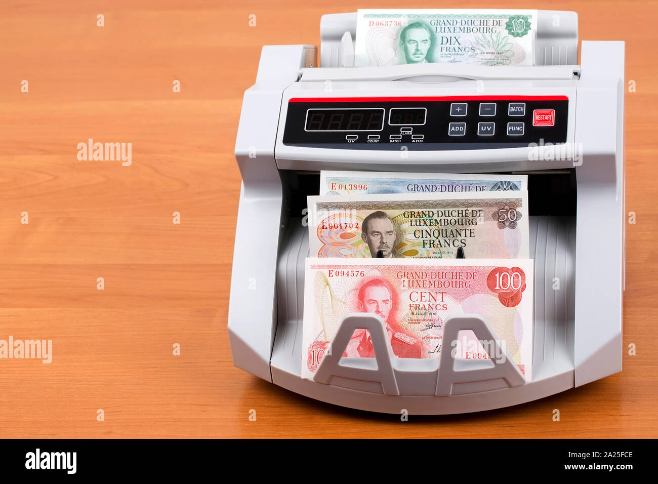 Luxembourg franc in a counting machine Stock Photo - Alamy
