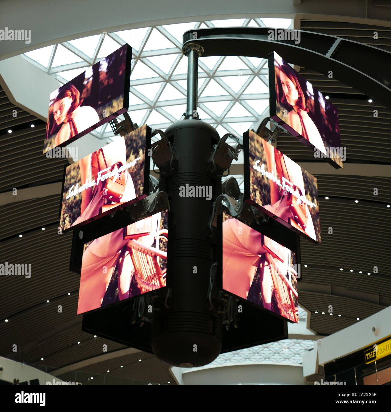 A bank of digital television screens in the departures terminal of Rome ...