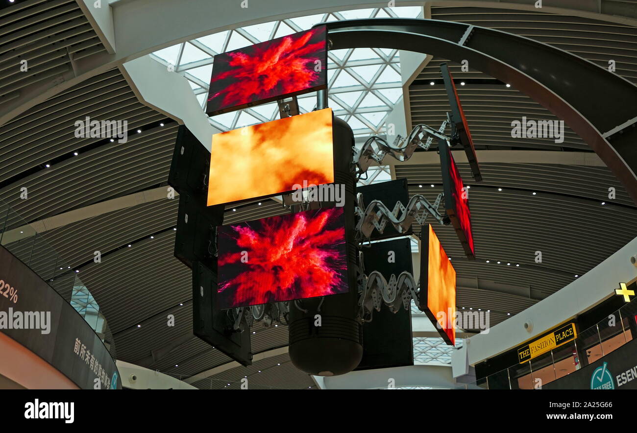A bank of digital television screens in the departures terminal of Rome ...