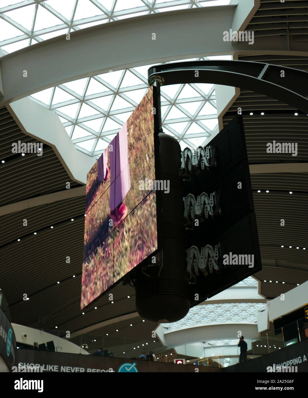A bank of digital television screens in the departures terminal of Rome ...