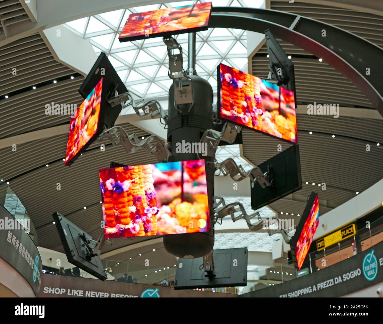 A bank of digital television screens in the departures terminal of Rome ...