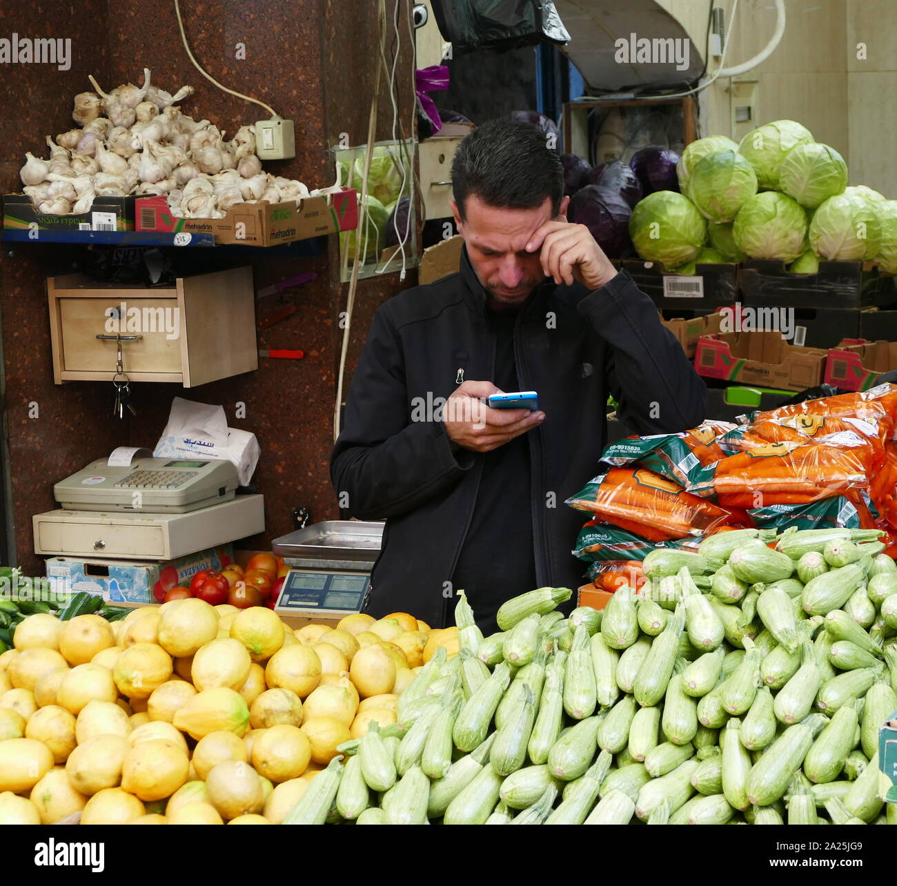 Arab man working on his vegetable stall inside the old city of ...