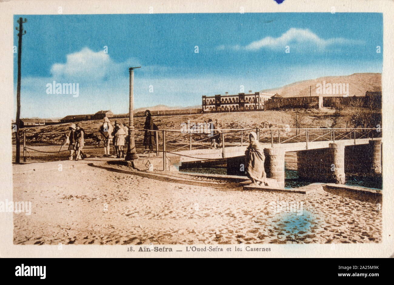 French Colonial Palace with school children crossing a bridge; Morocco ...
