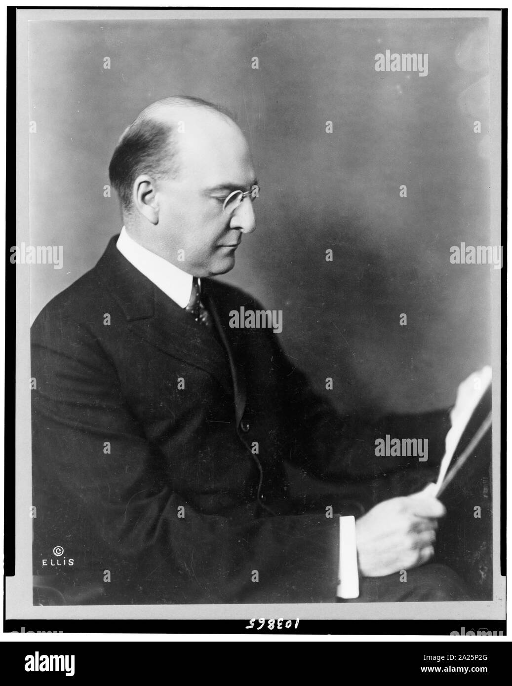 Pierre S. Dupont, half-length portrait, seated, facing right reading ...